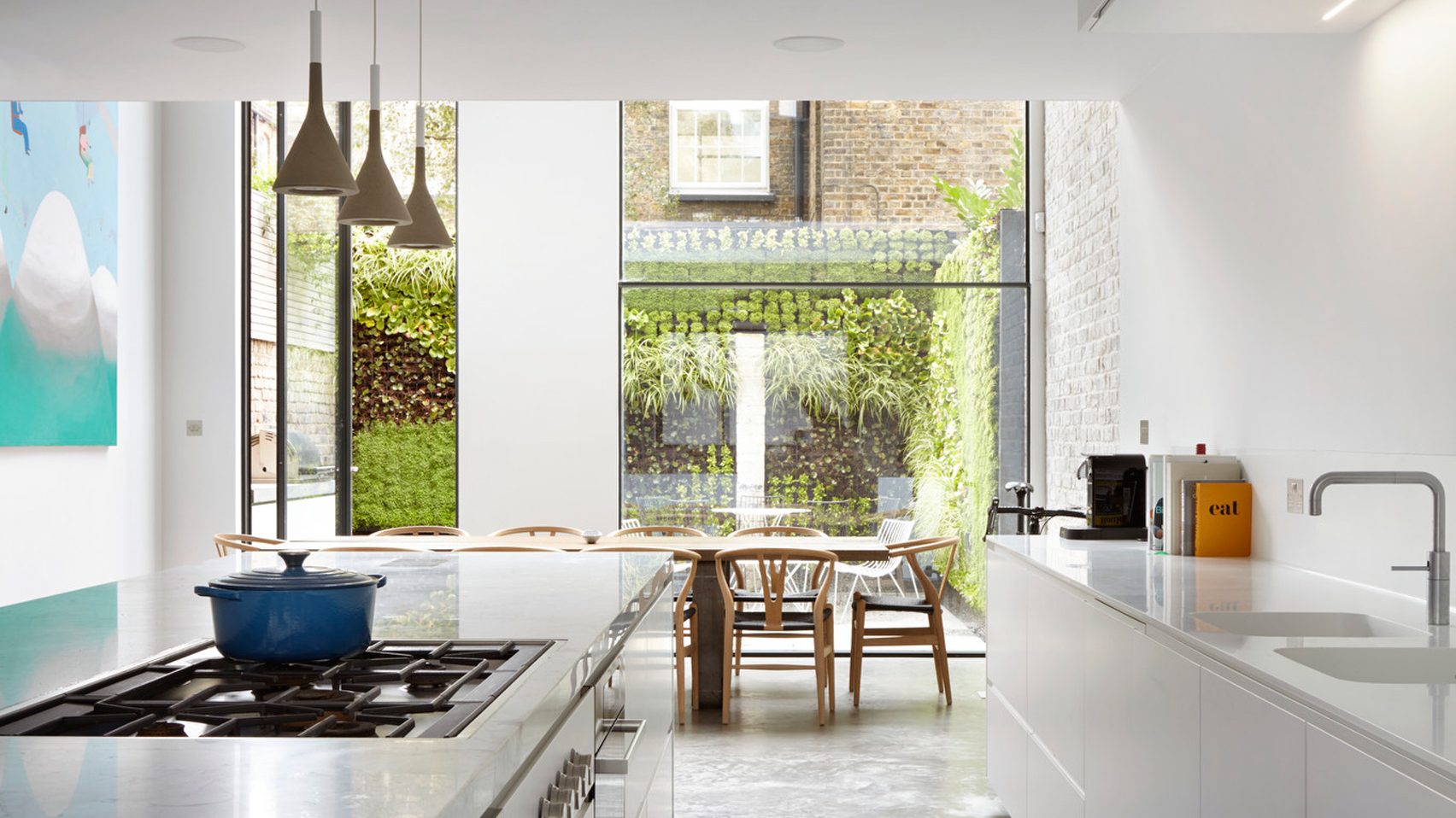 Extra-tall windows connect Studio Octopi's Slot House with its patio garden