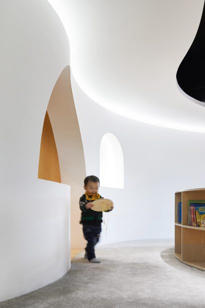 Curving wood-lined nooks create private reading pockets in Shanghai ...