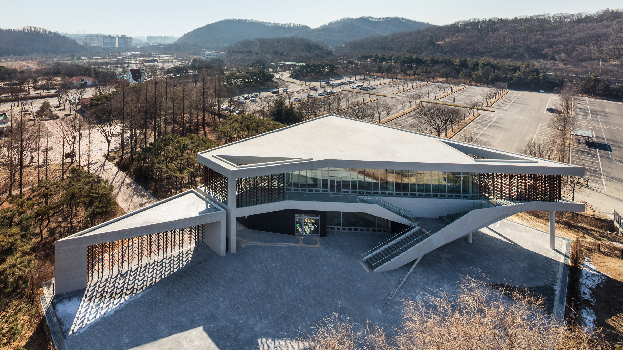 Moveable Wooden Screens Are Set Into Concrete Facades Of Wood Museum