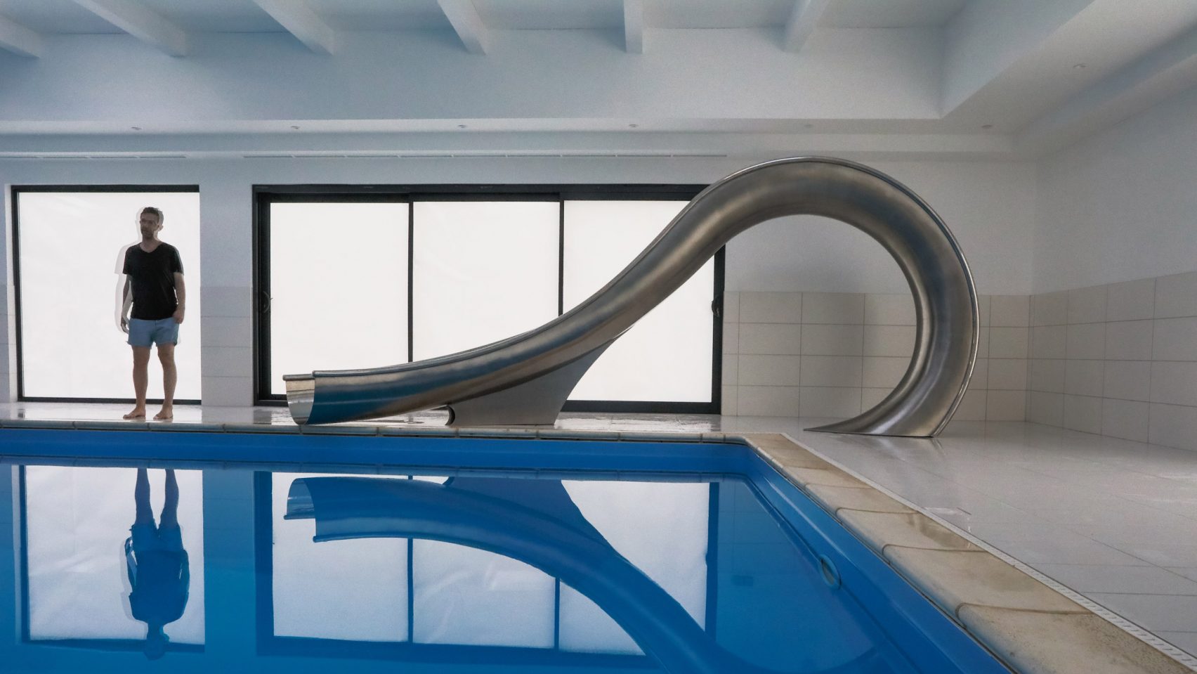 Splinterworks' stainless steel waterslide mimics curvature of a wave
