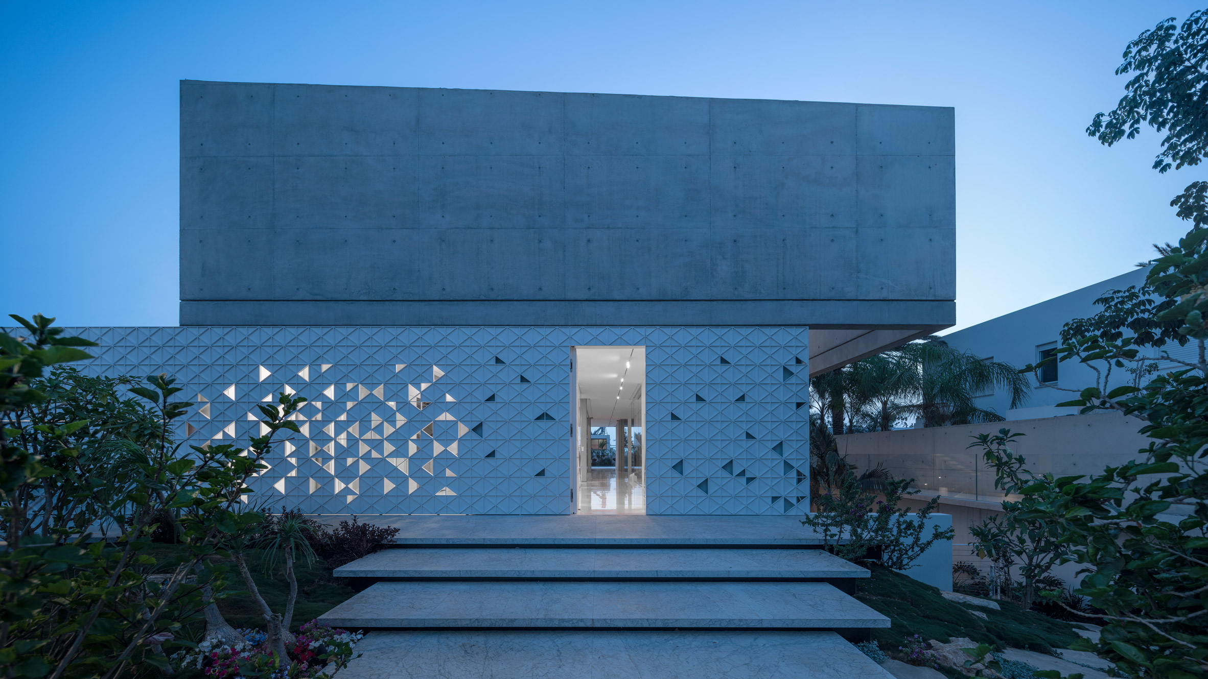 Triangles Of Light Animate Perforated Facade Of House By Pitsou Kedem
