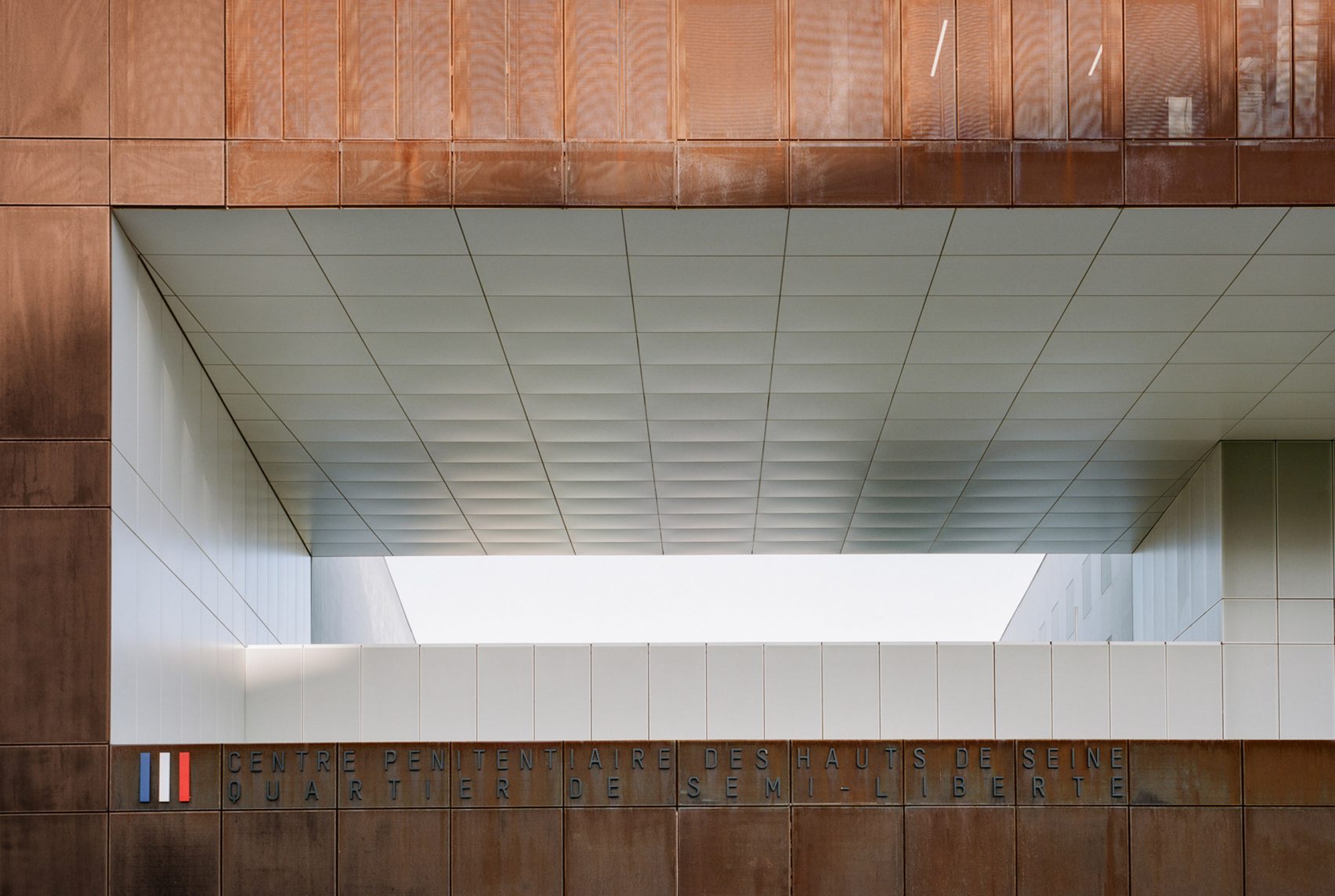 Minimum Security Prison Made Of Steel Has Pastel Coloured Sports Court