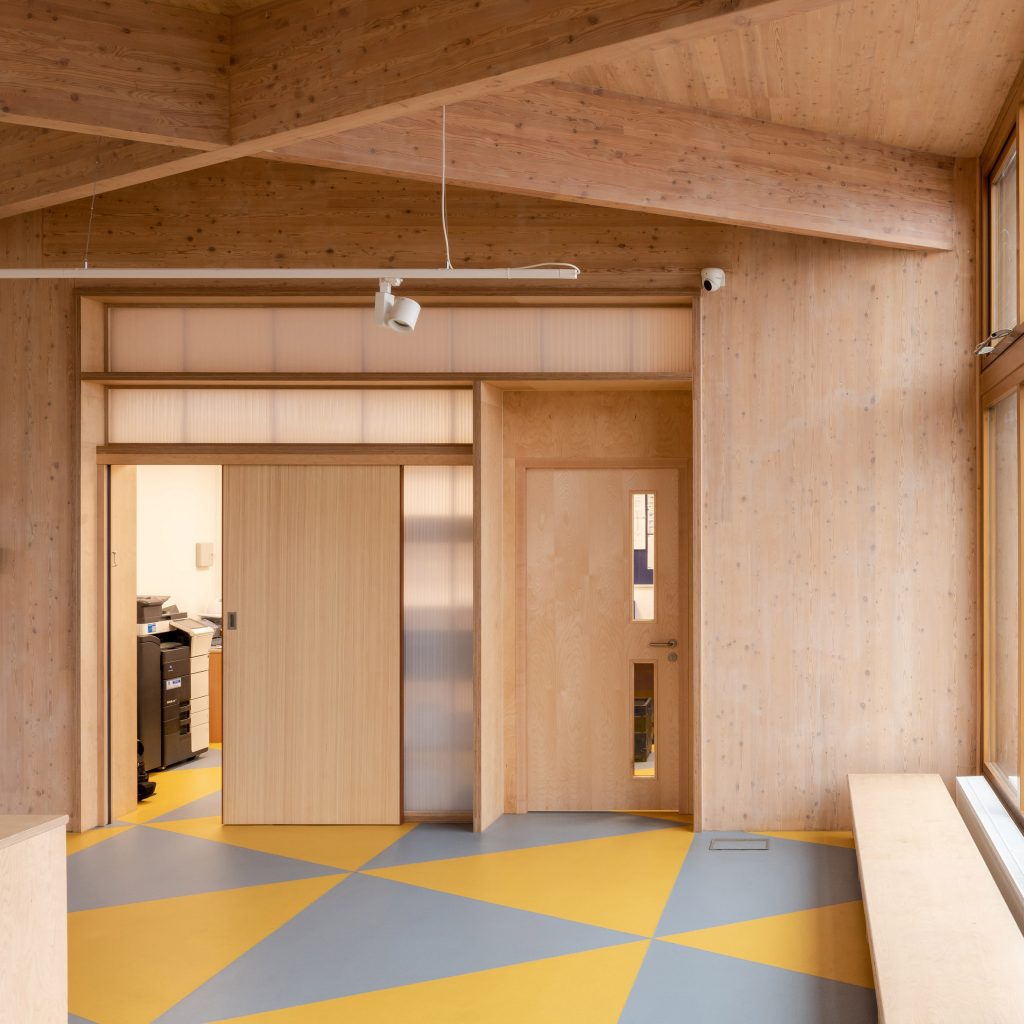 DK-CM unites post war and 1990 schools with CLT reception pavilion
