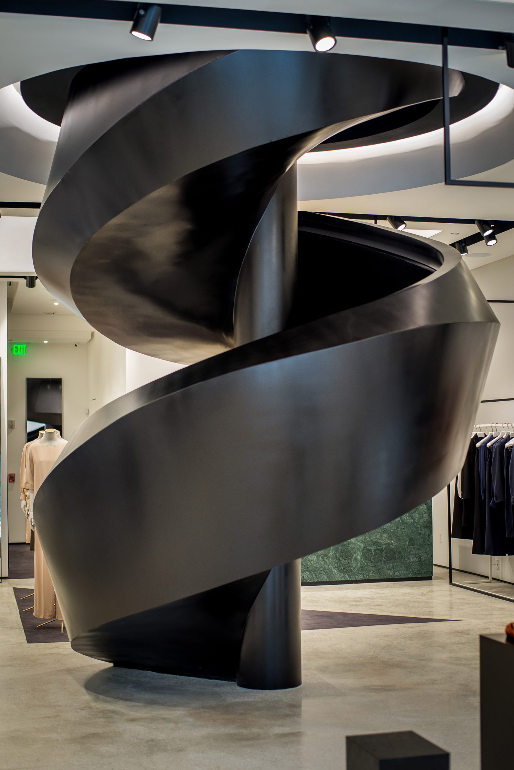 Black spiral staircase twists through Joseph store in Miami Design ...