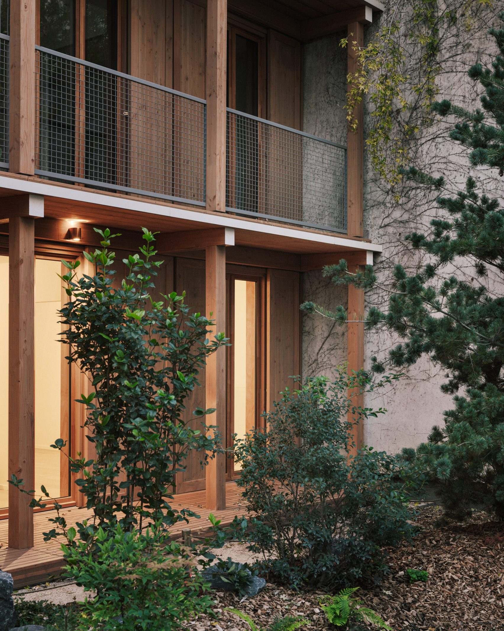 Mars Architectes creates wooden apartment block enclosed by 1970s ...