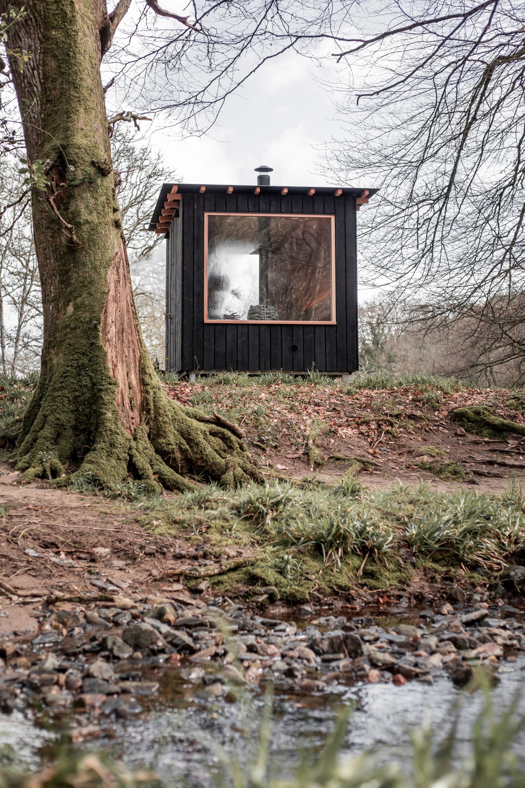 Out of the Valley clads prefabricated Forest Sauna in charred wood