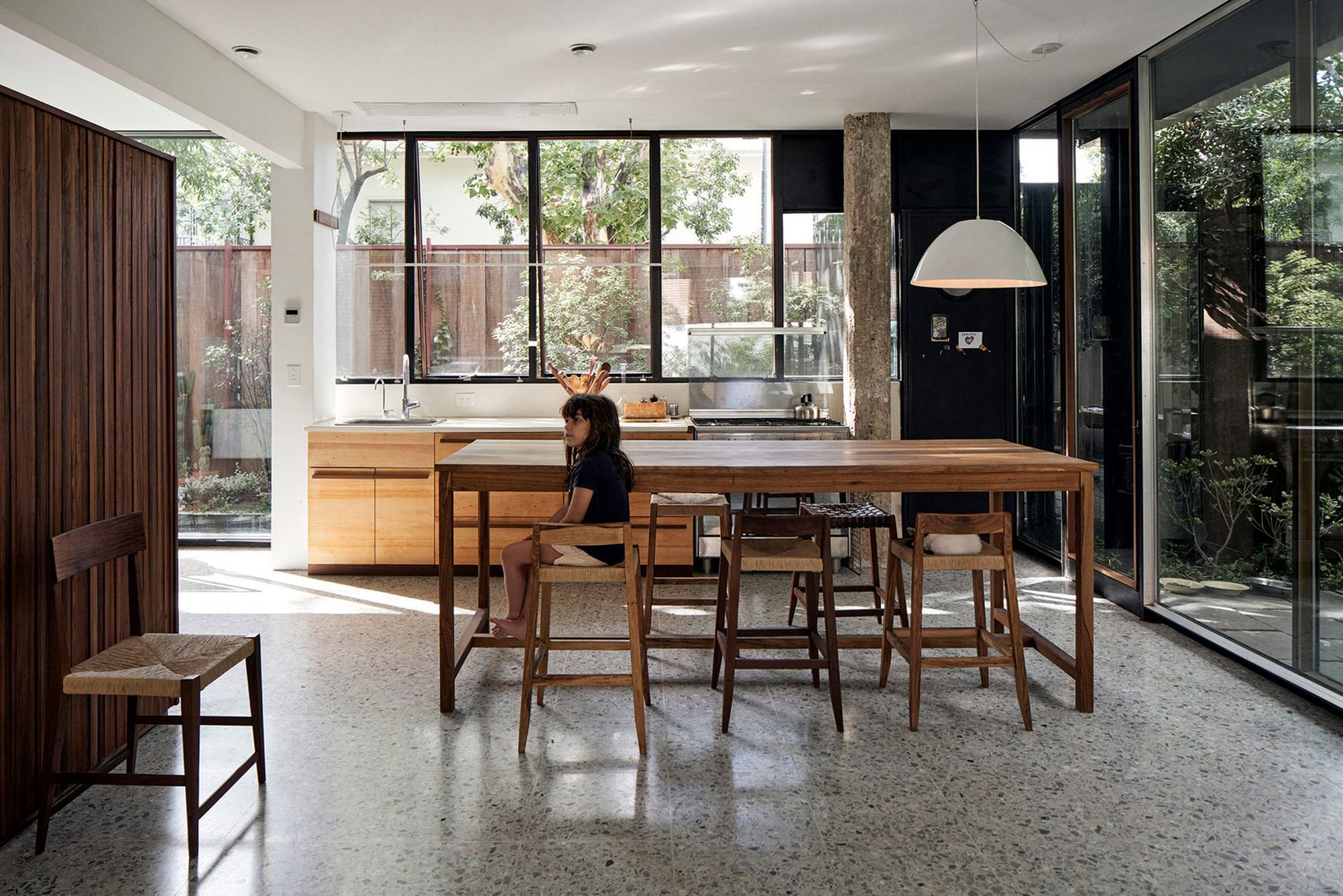 La Base Studio wraps glass Buenos Aires house with shading screen ...