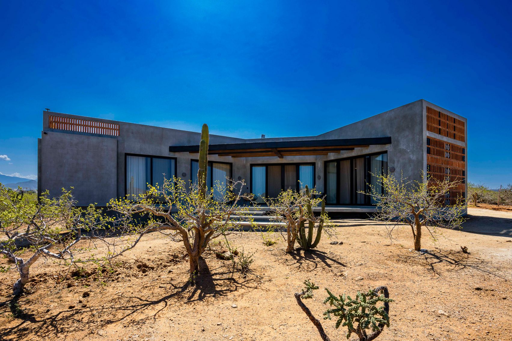 RED Arquitectos integrates corn millstone into facade of Mexican house