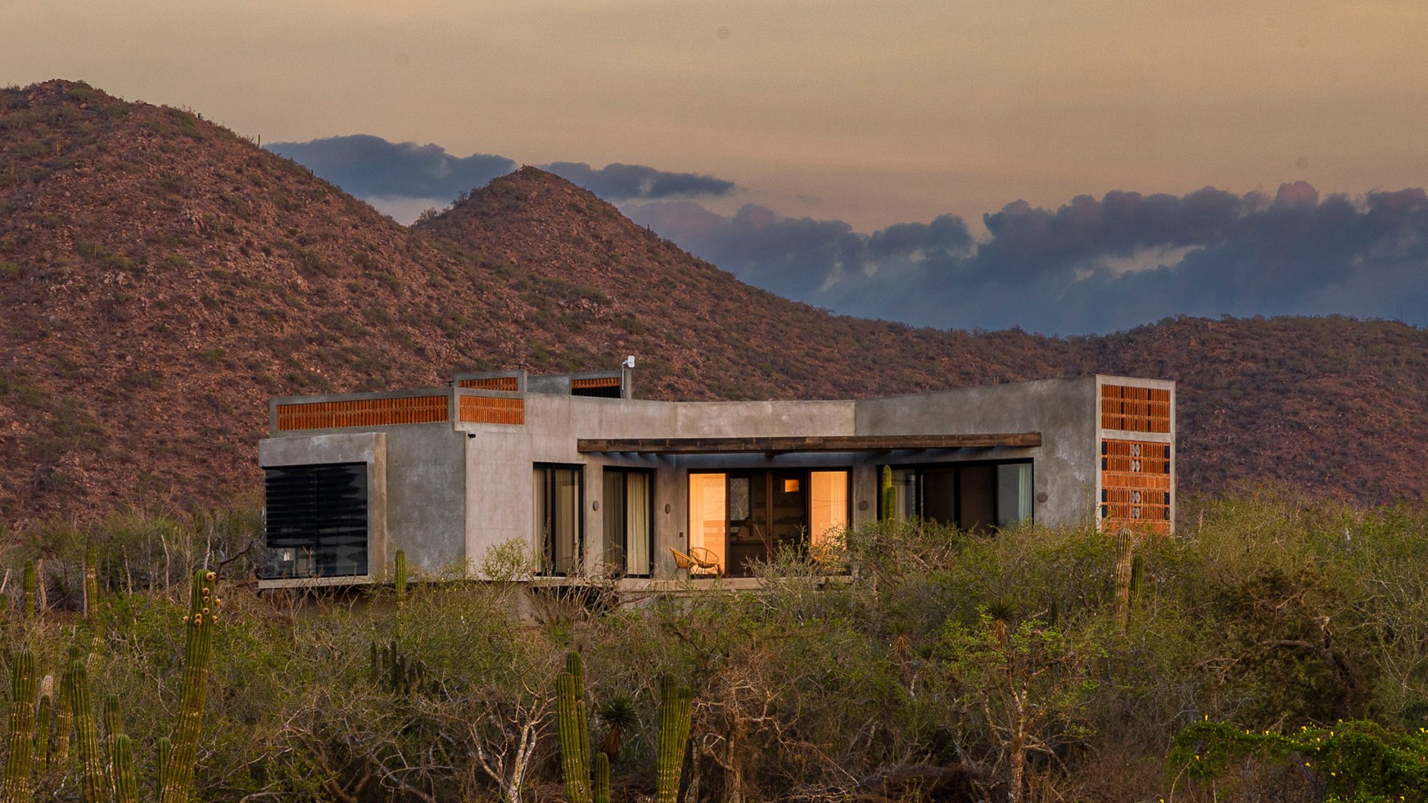 RED Arquitectos integrates corn millstone into facade of Mexican house
