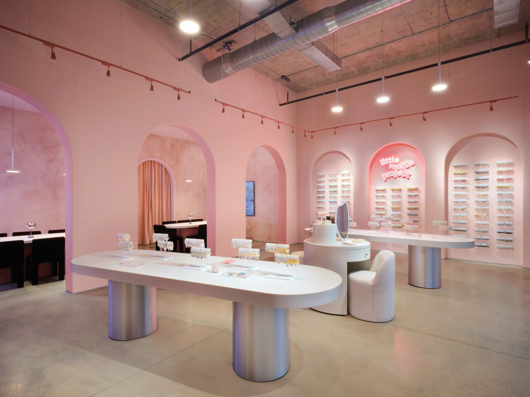 Gharib Studio outfits Austin jewellery store with pink walls and arches