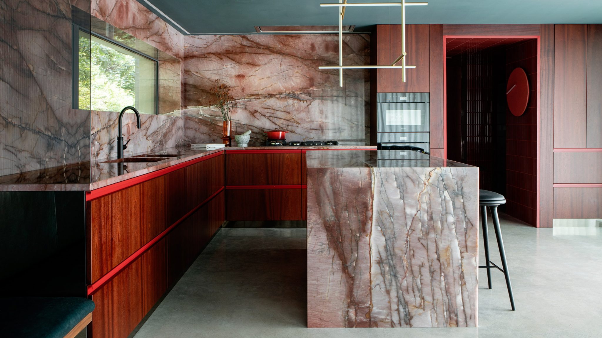 Kingston Lafferty Design includes "sensual" red kitchen in home renovation