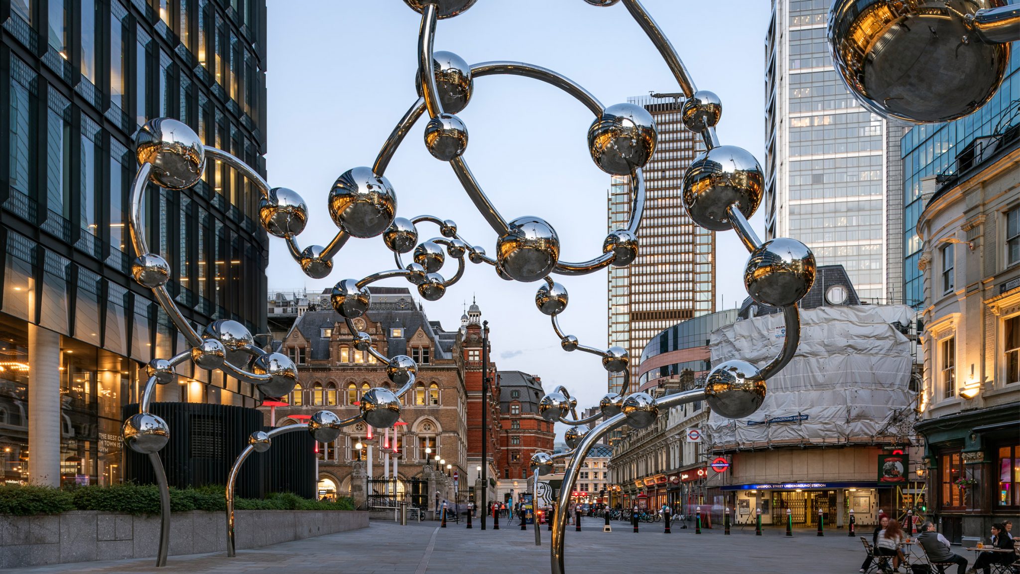 Yayoi Kusama installs mirrored orbs outside London tube station