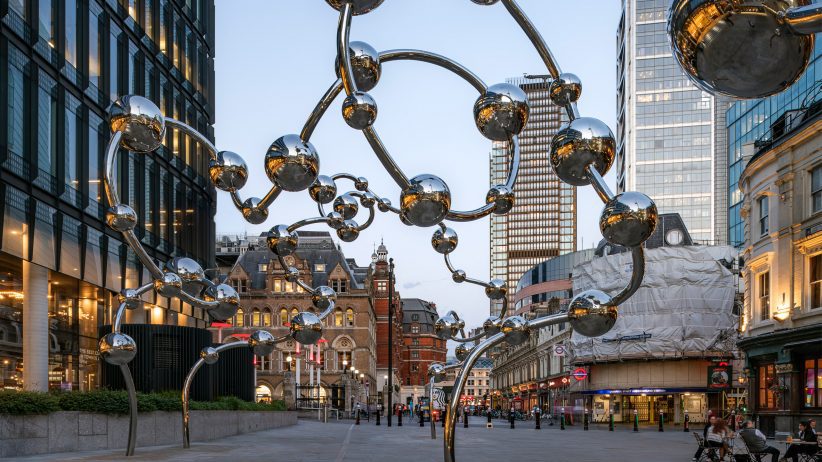Yayoi Kusama installs mirrored orbs outside London tube station