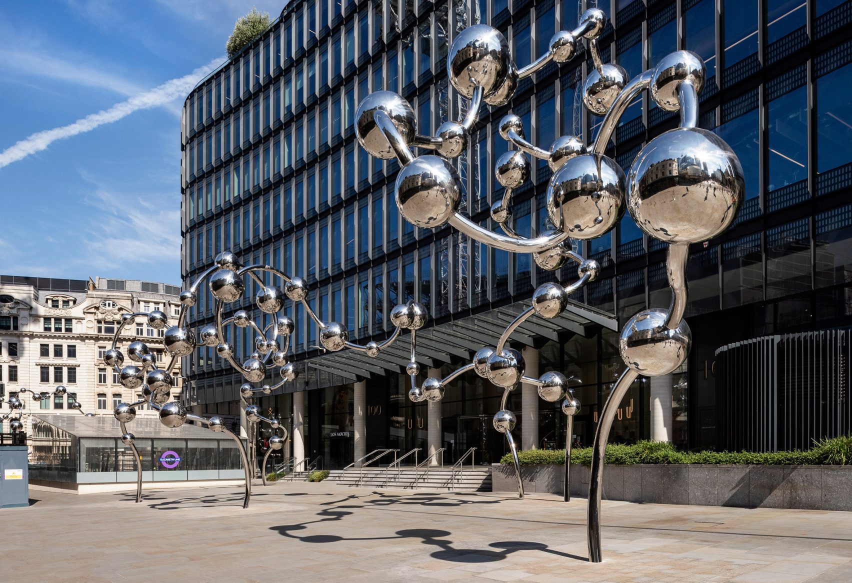 Yayoi Kusama installs mirrored orbs outside London tube station