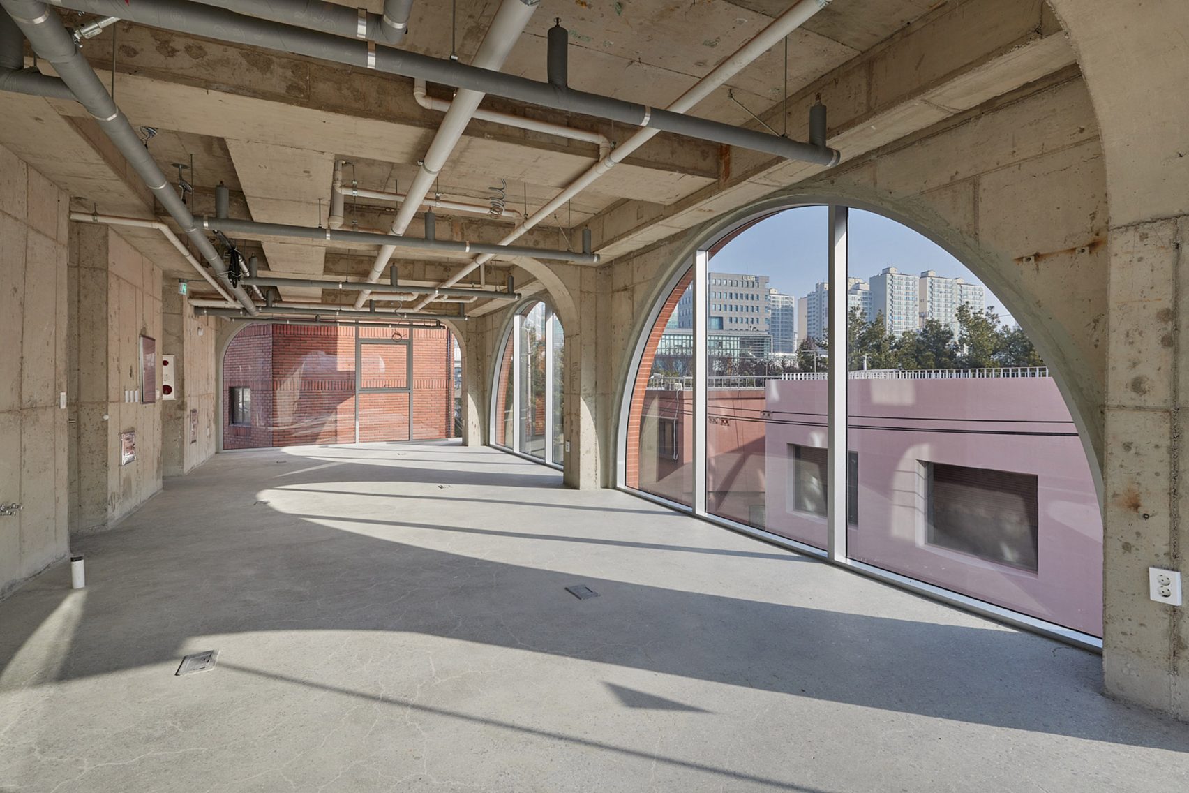 Arched brick openings enliven Fillome Building in Seoul by Sosu Architects