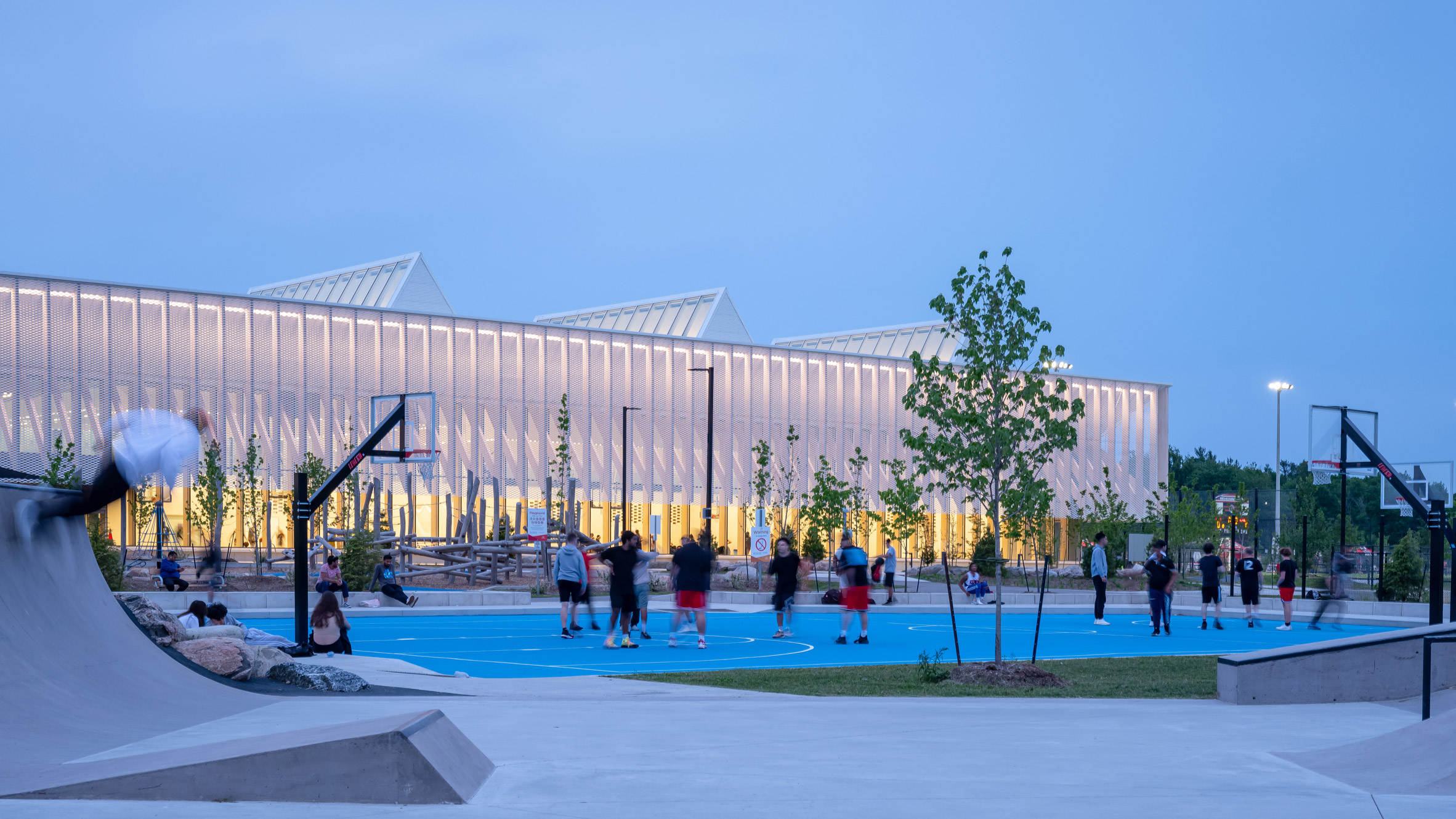 MJMA Architecture & Design marries wood and mesh for sports centre