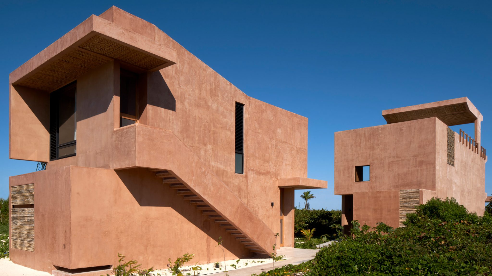 Reyes Ríos + Larraín Arquitectos extend pink house in Yucatán