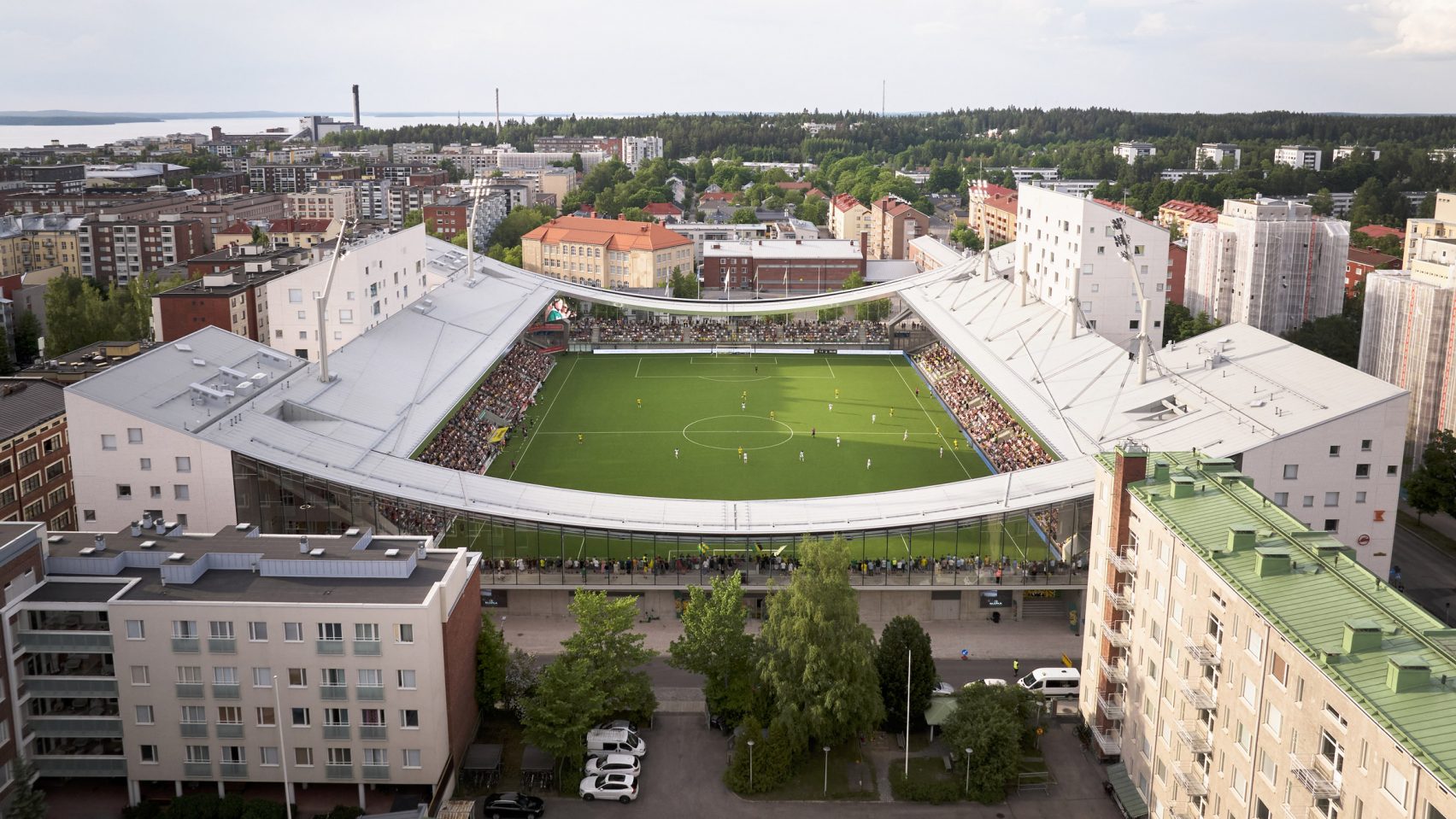 JKMM Architects combines football field with housing at Tammela Stadium