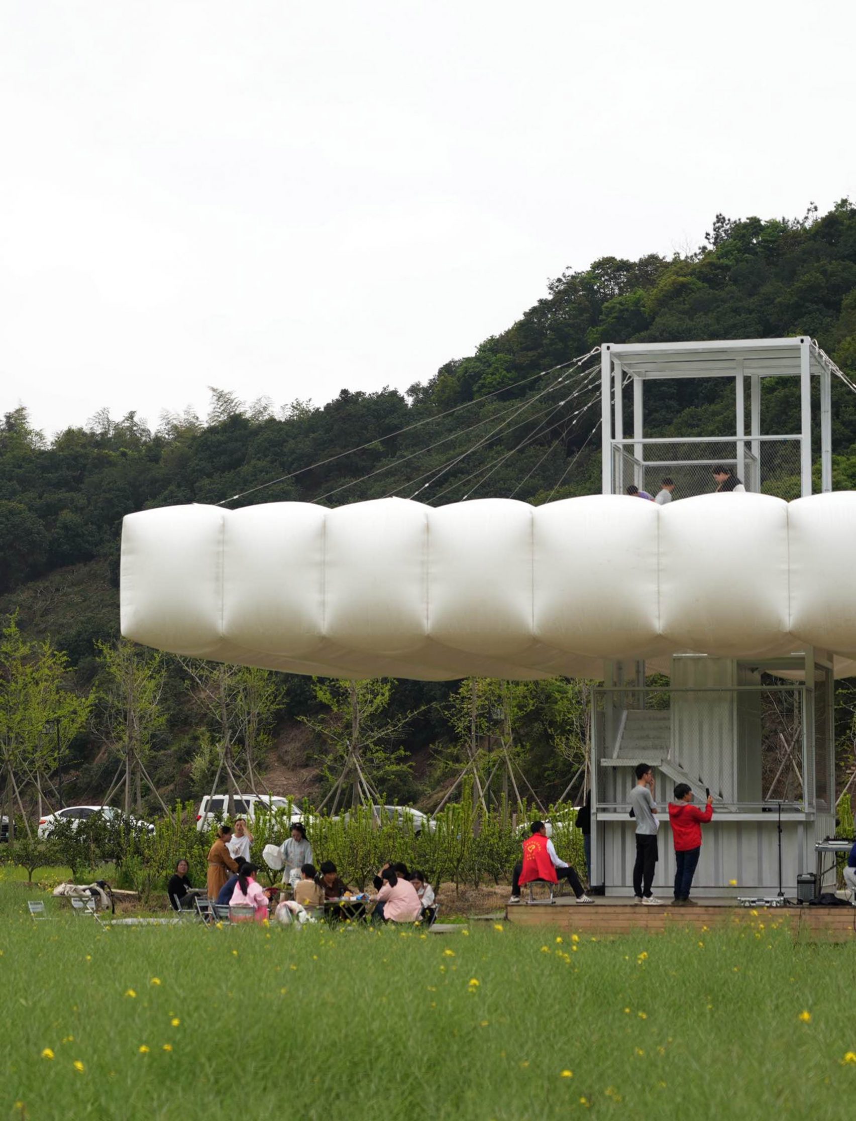 Shipping containers and inflatables form Down in the Clouds pavilions