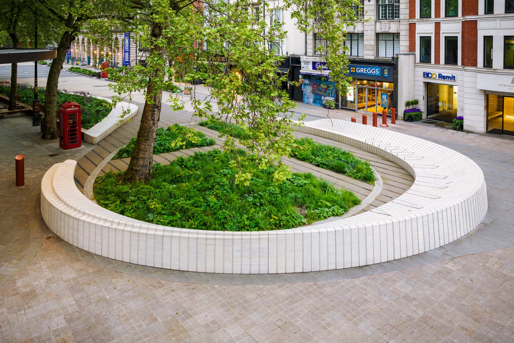 Undulating benches provide versatile public seating on London's Strand