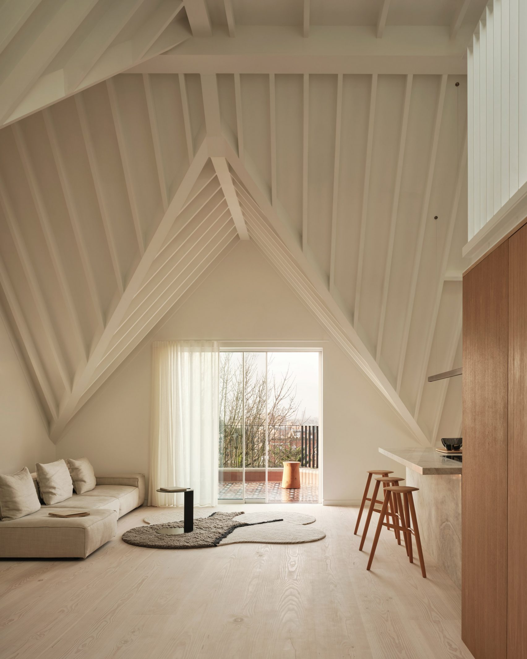Mata Architects expands Vaulting Loft flat with "cathedral-like" roof