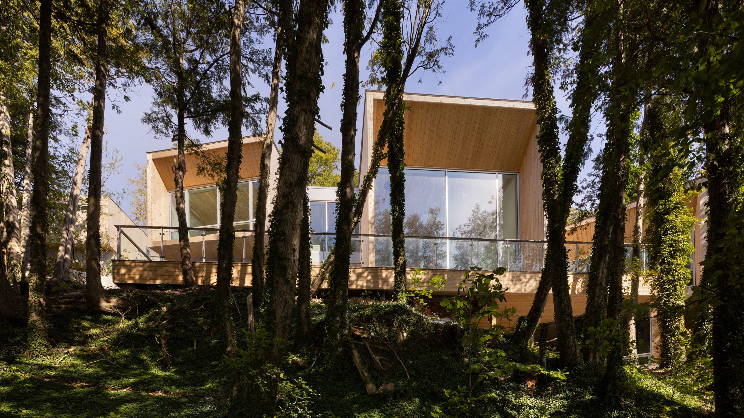 Omar Gandhi cascades cedar lake house down Canadian hillside