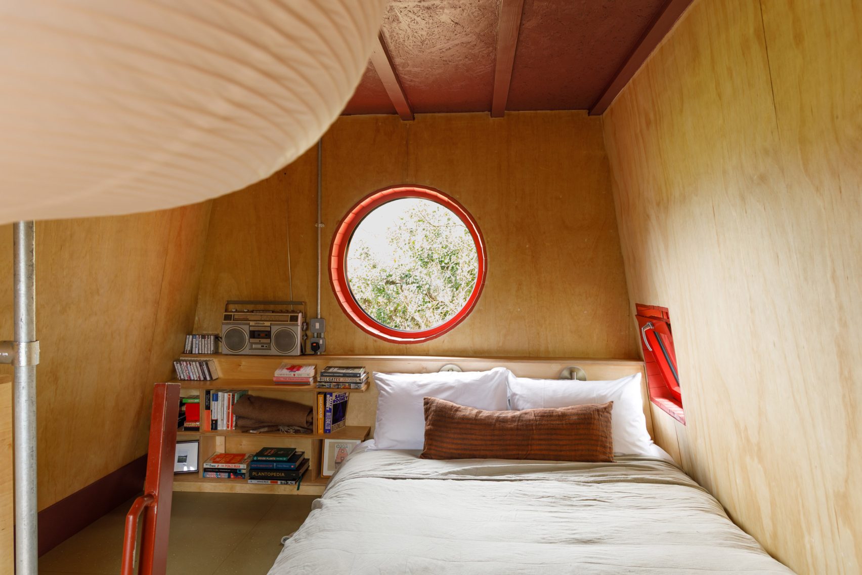 Studio Bucky cloaks Cucu cabin in Ireland with red shingles