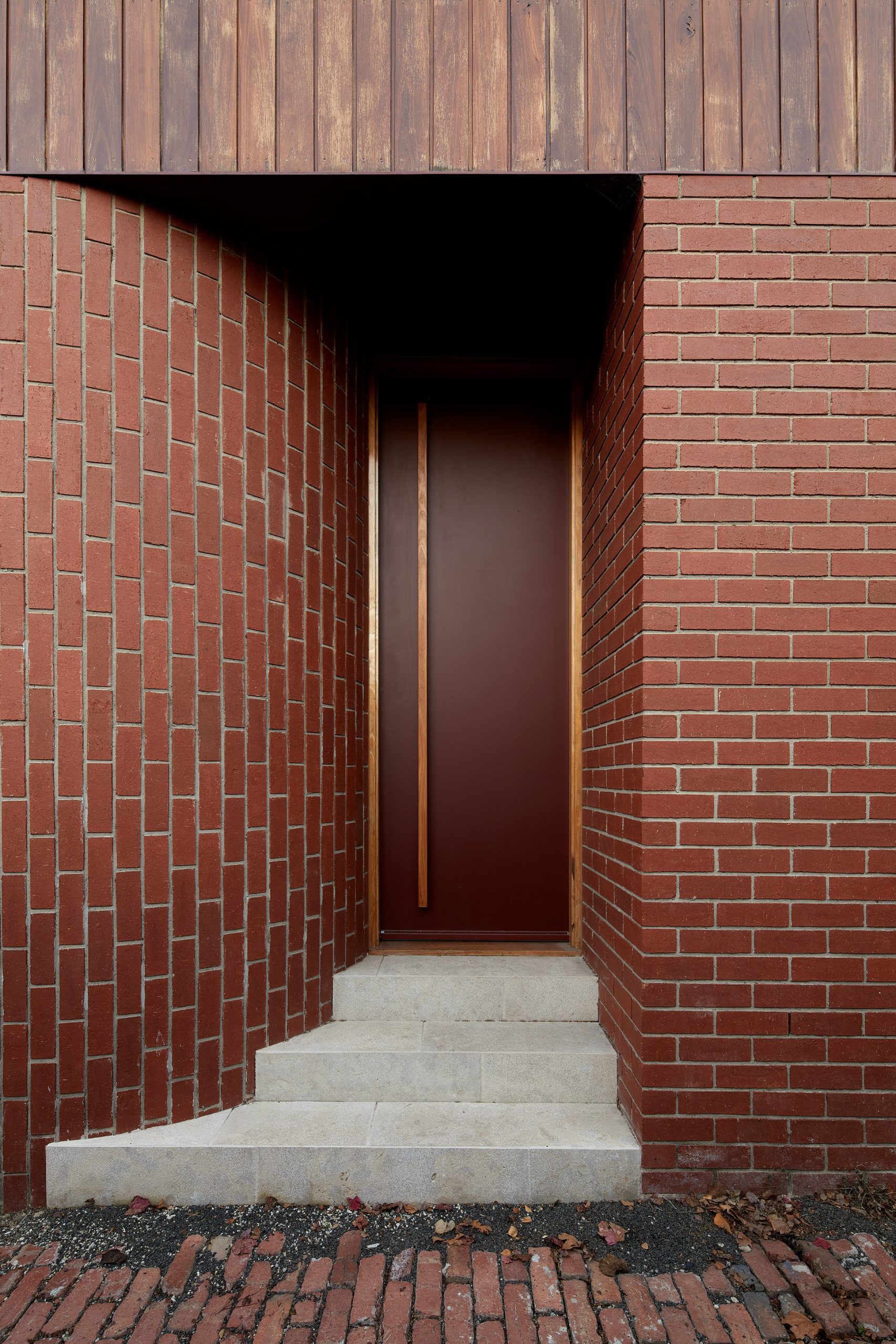 MRTN Architects extends Laneway House with red-brick volumes